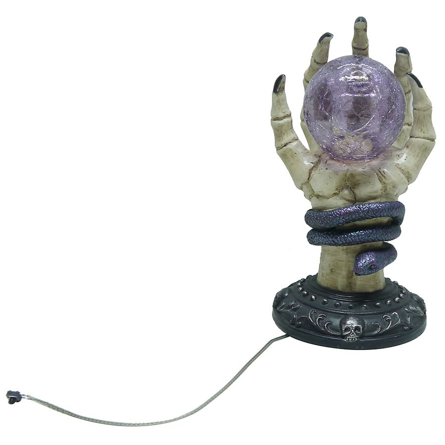 Skeleton Hand Holding Crystal Ball